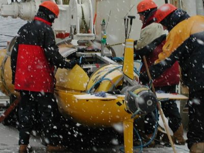 Terrain-aided navigation for long-range AUVs in dynamic under-mapped ...